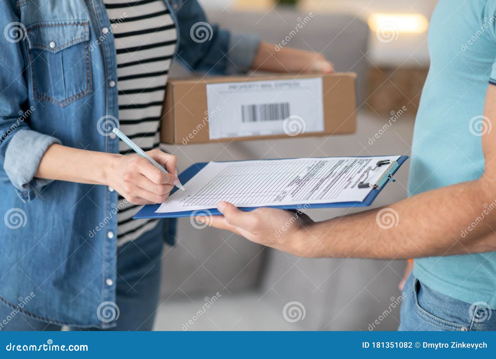 Female Hands Holding Parcel and Signing Delivery Documents Stock Photo ...