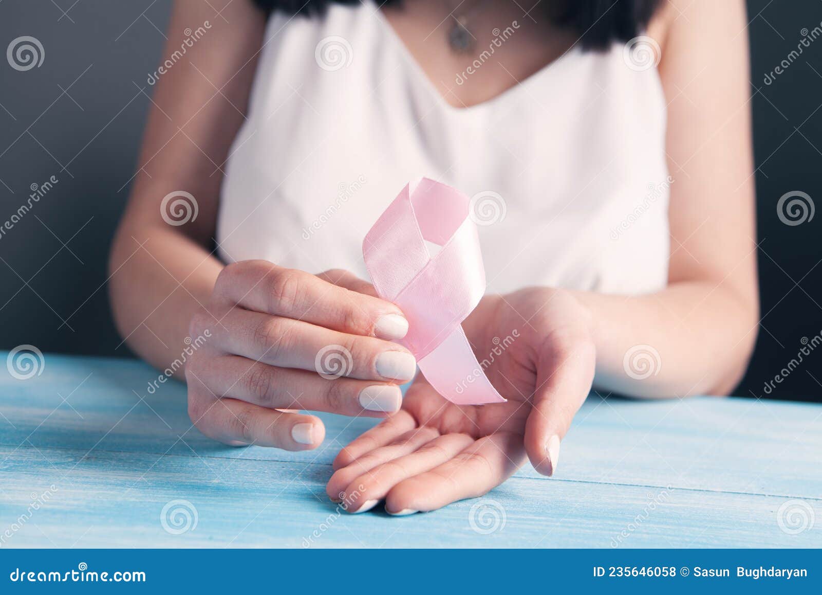 Female Hands Holding a Pink Ribbon Stock Photo - Image of symbol, pink ...