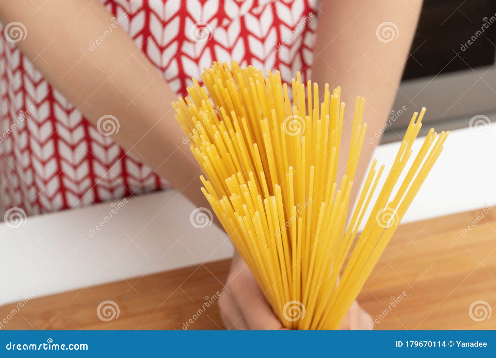 Female Hands Holding Spaghetti in the Kitchen Stock Photo - Image of ...