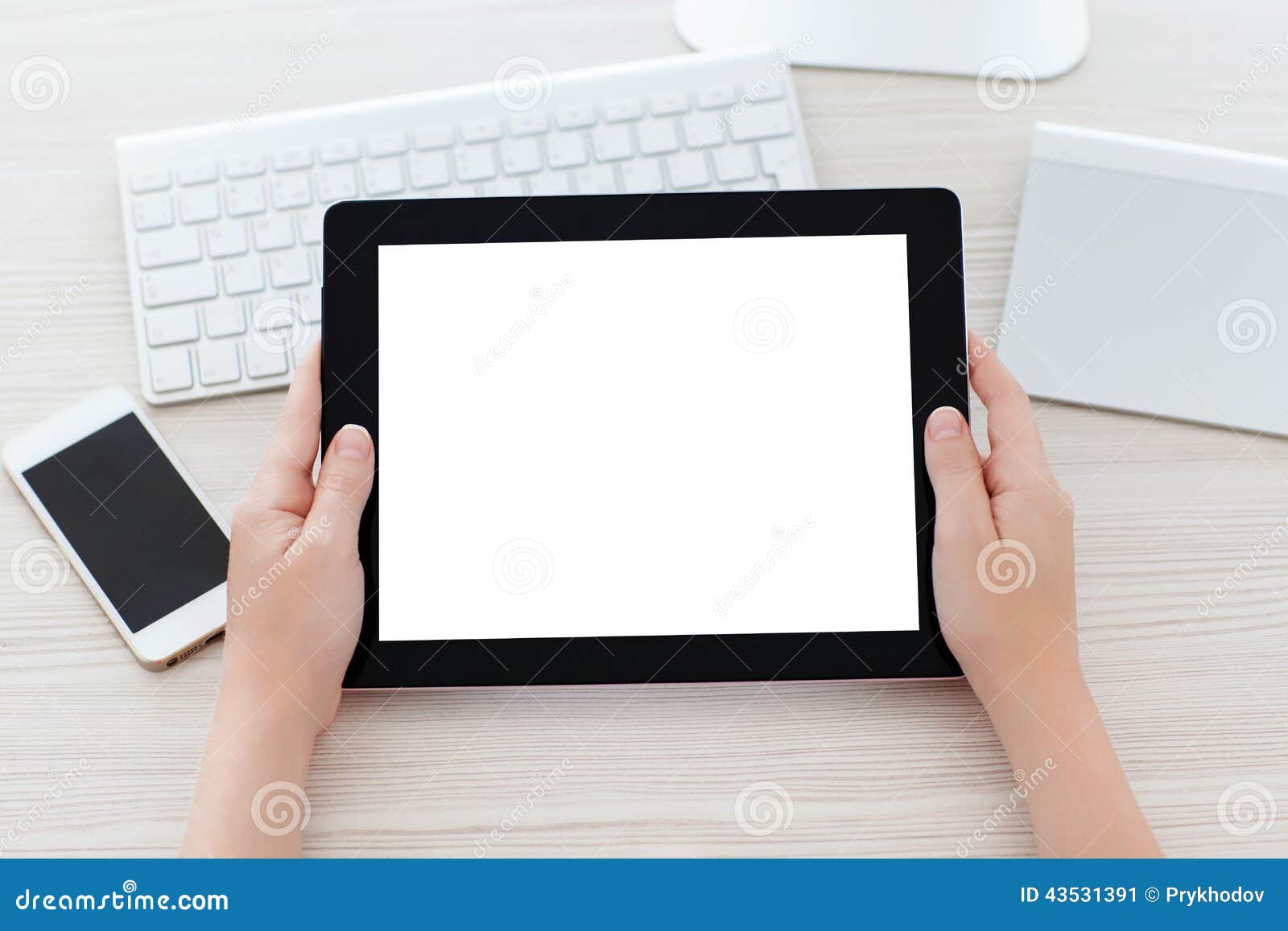 Female Hands Holding a Tablet with a Isolated Screen Over a Table Stock ...