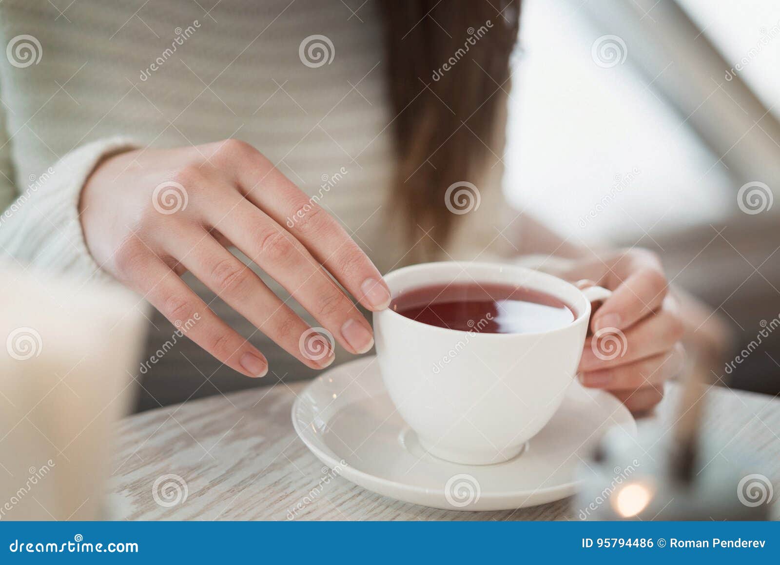 Female Hands Holding a White Cup of Tea Standing on the Table Top View ...