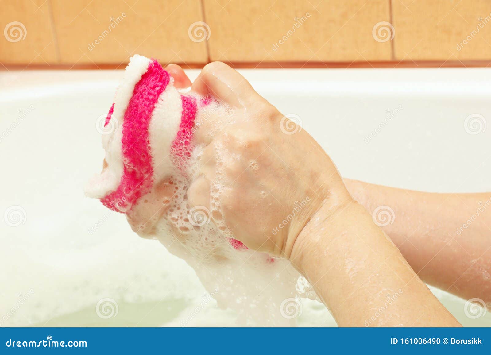 Female Hands Lathering Striped Sponge with Soap Stock Photo - Image of ...