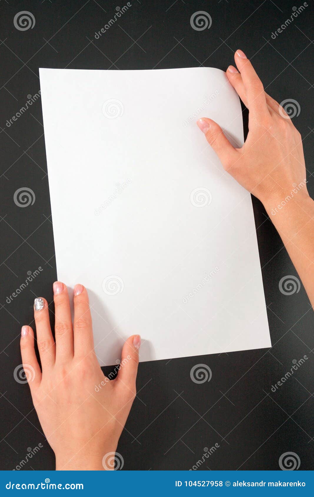 Female Hands with Paper on a Black Background. Studio Isolate. Stock ...