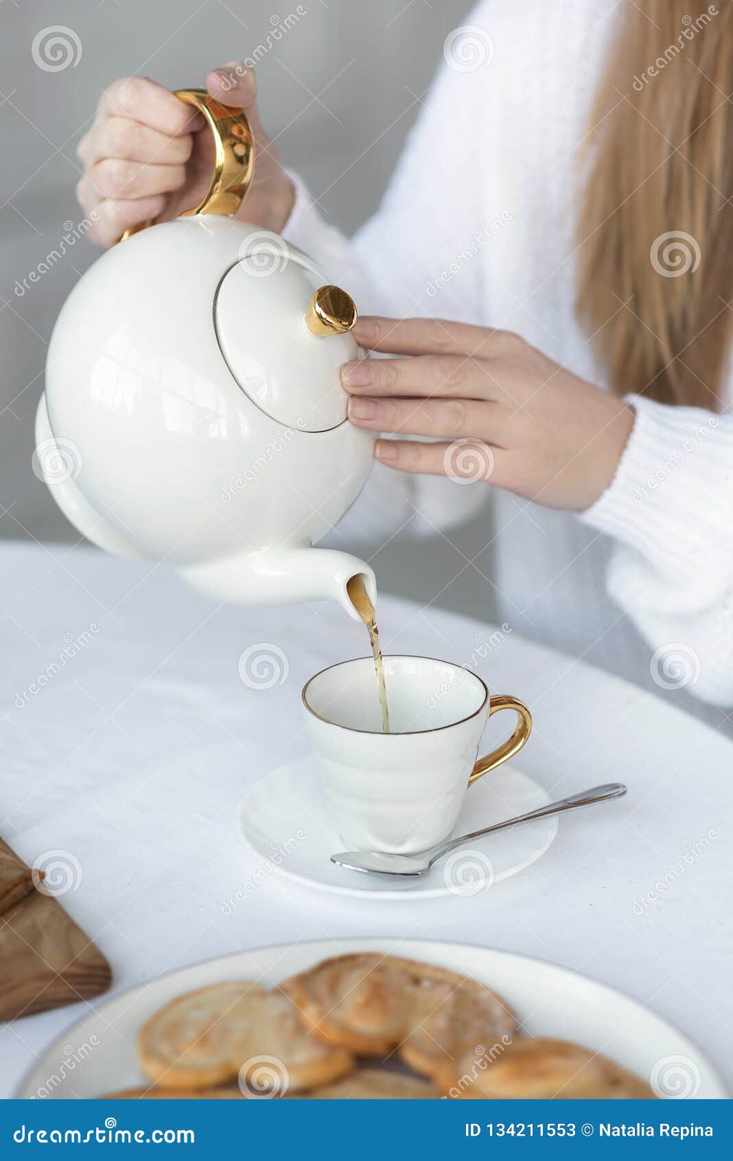 Hands pouring tea stock image. Image of love, evening - 134211553