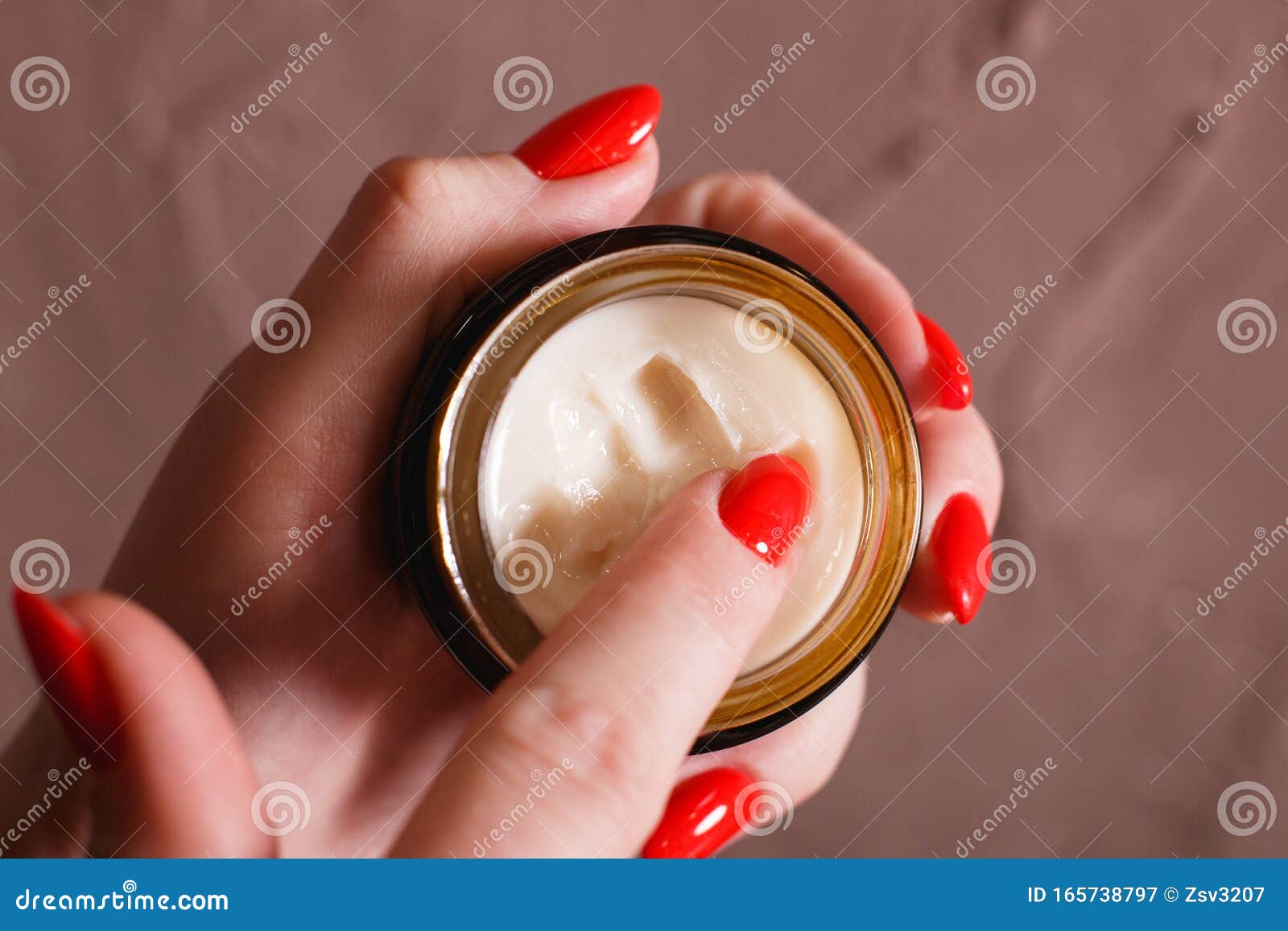 Female Hands with Red Nails Applied Hand Cream. Texture of Cream ...