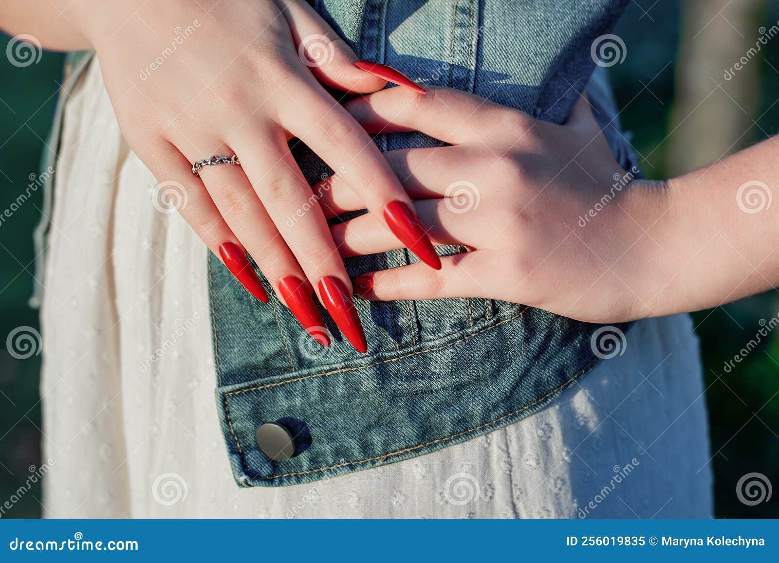 Female Hands With Red Stiletto Nail Design Glitter Red Nail Polish