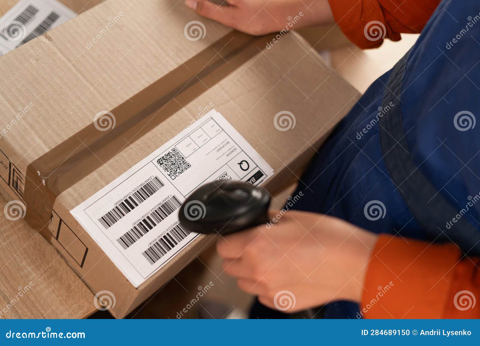 Female Hands Scanning Barcode on Delivery Parcel. Worker in Factory ...