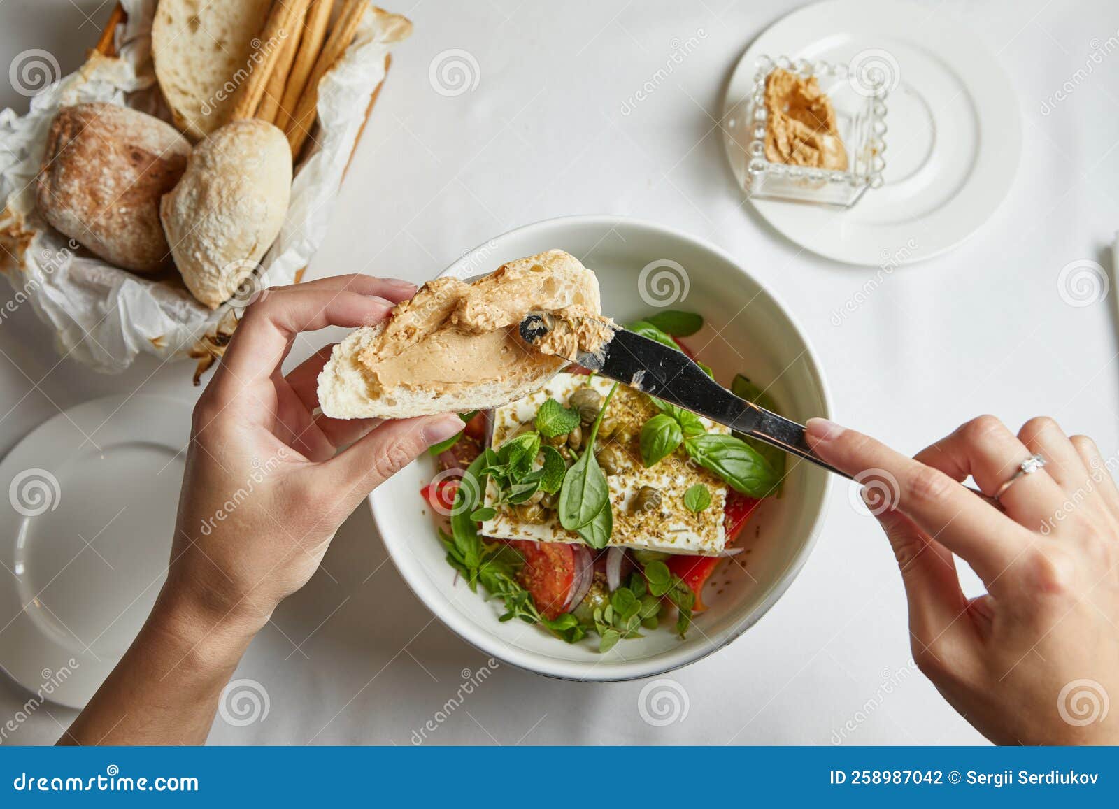 Female Hands while Spreading Butter on Bread while Eating Stock Photo ...