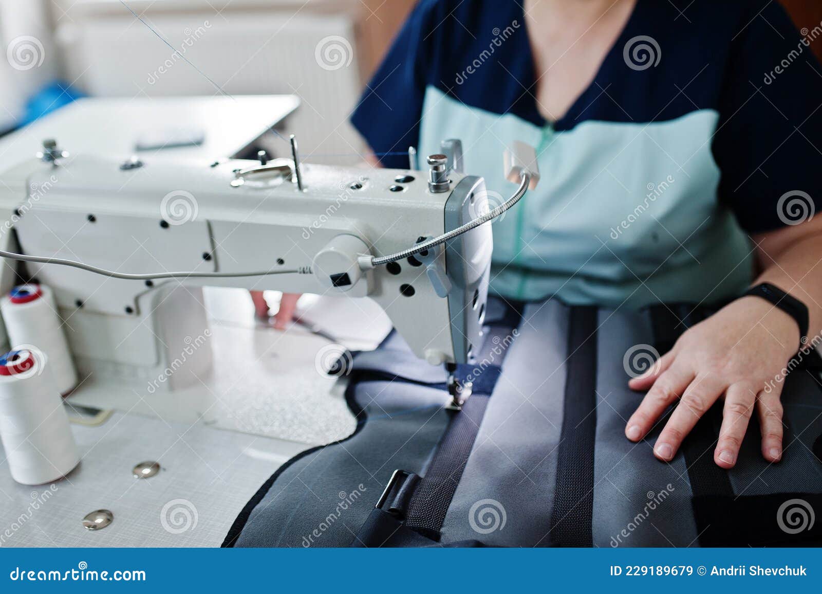 Female Hands Stitching Fabric on Professional Manufacturing Machine at ...