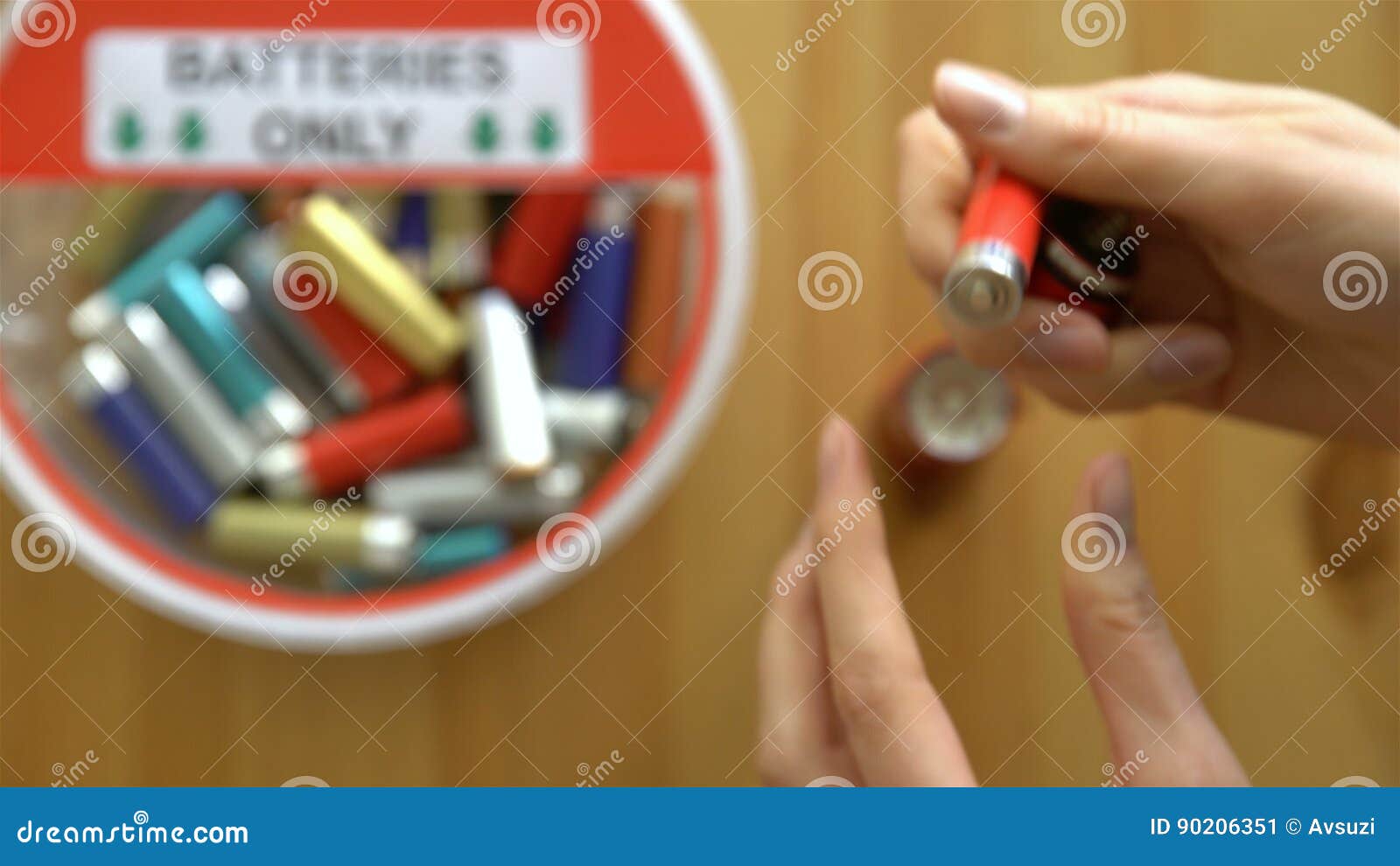 Female Hands Take Out a Used Battery from a Flashlight and Put it in ...