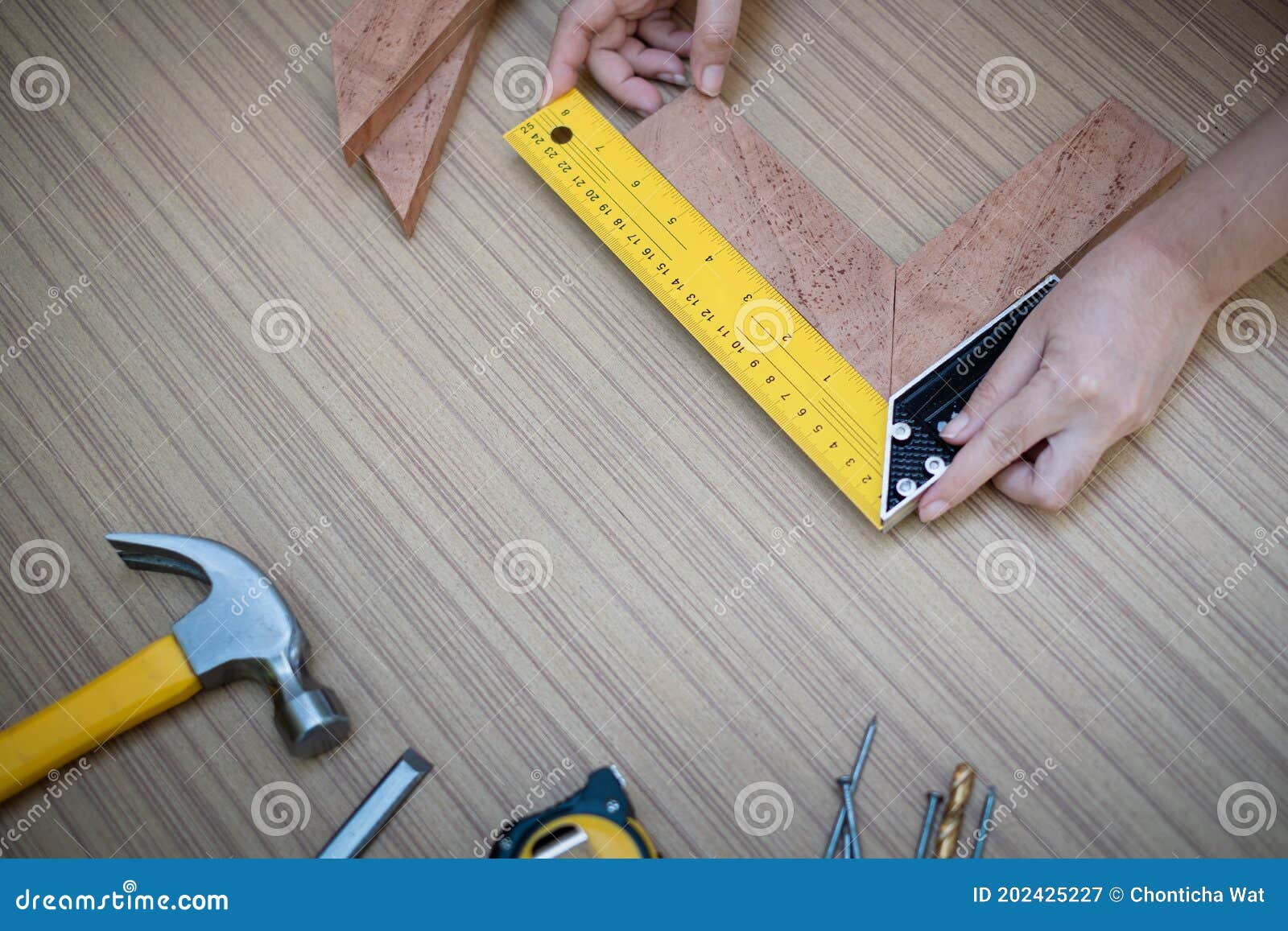 Female Hands Using a Try Square To Check that the Woodworking Corners ...