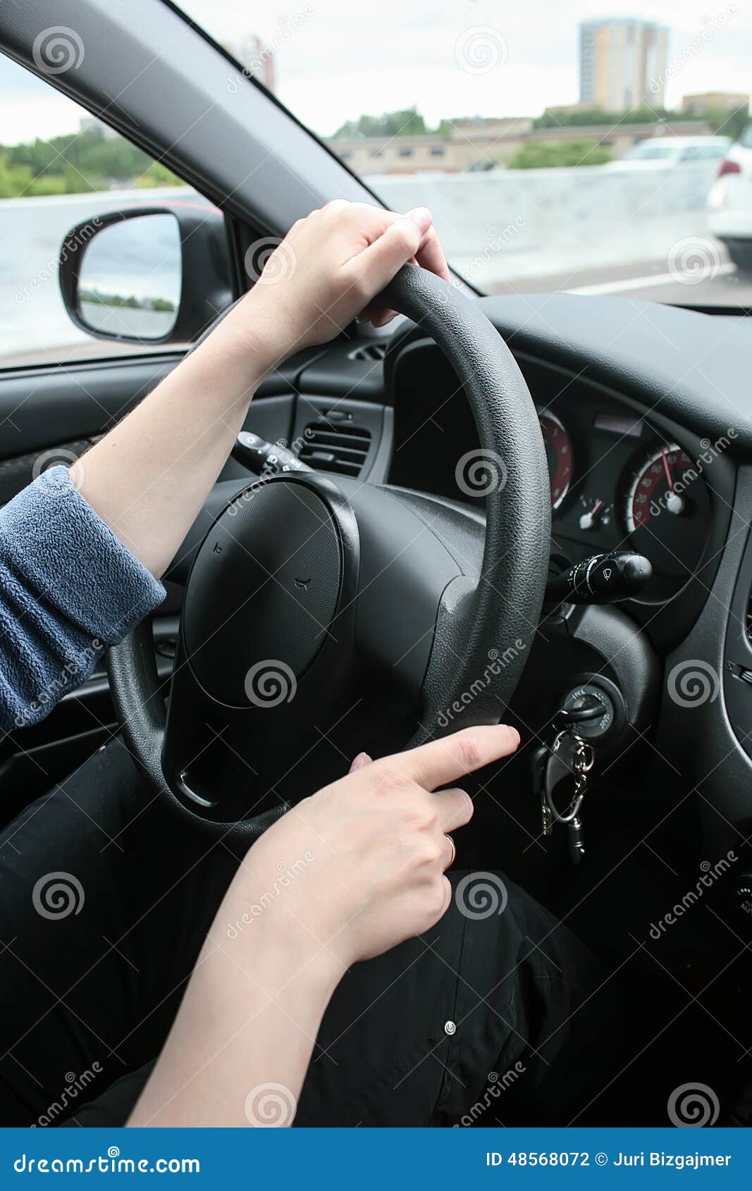 Female hands on wheel stock photo. Image of close, odometer - 48568072