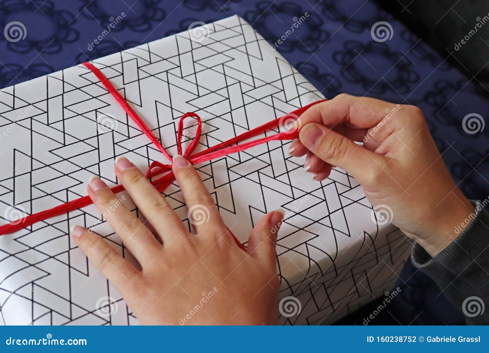 Female Hands Wrapping or Unwrapping a Gift Pack Stock Photo - Image of ...