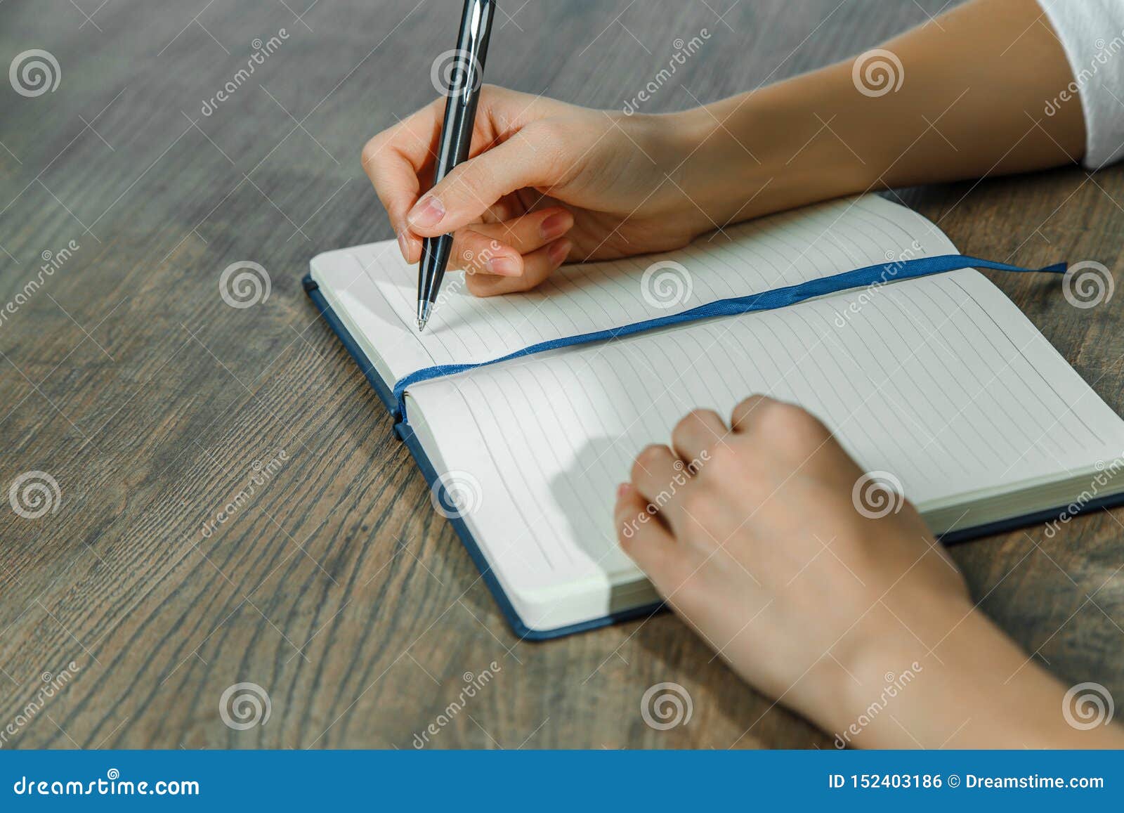 Female Hands are Writing in a Notebook Stock Photo - Image of hands ...