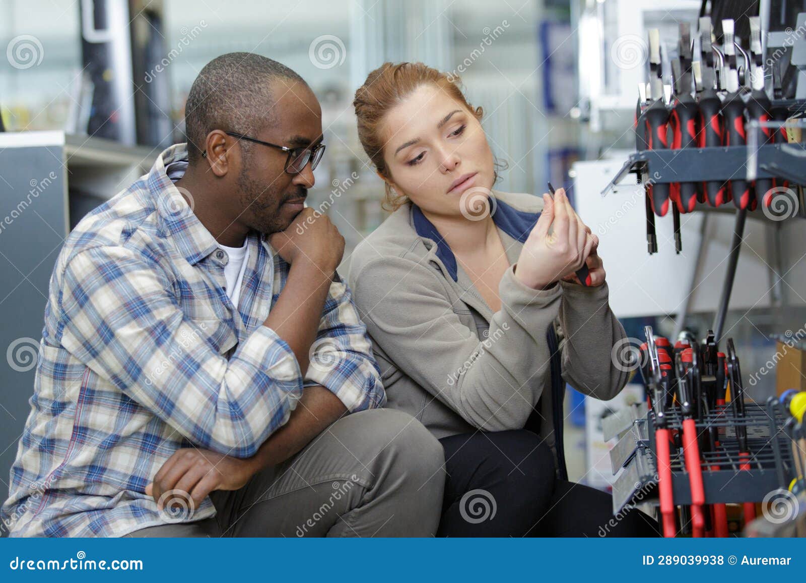 Female Hardware Store Talking To Male Customer Stock Photo - Image of ...