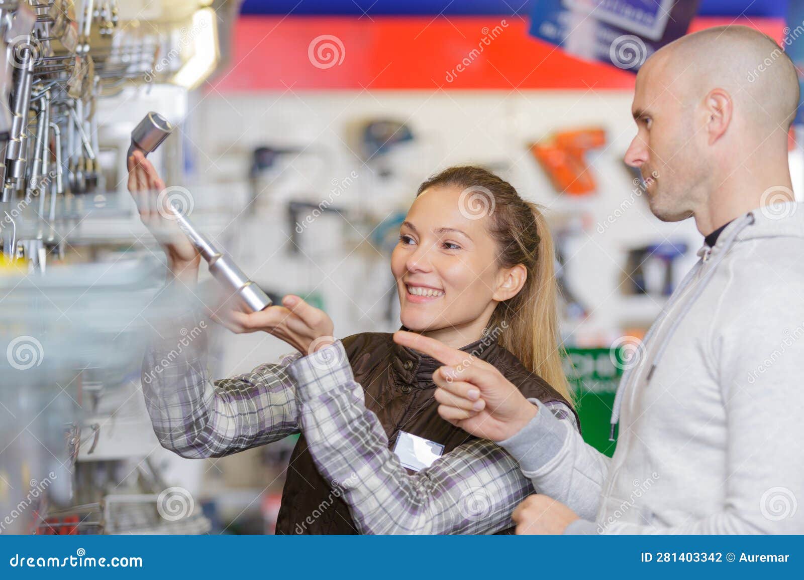 Female Hardwarer Store Worker Assisting Male Customer Stock Photo ...