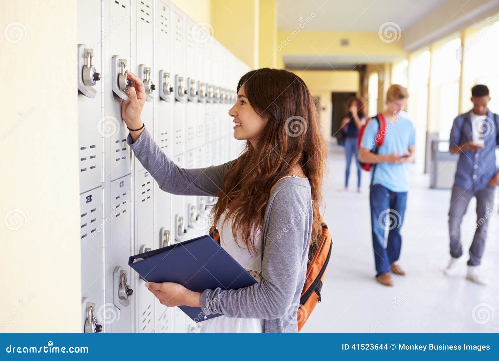 Female High School Student Opening Locker Stock Photo - Image of ...