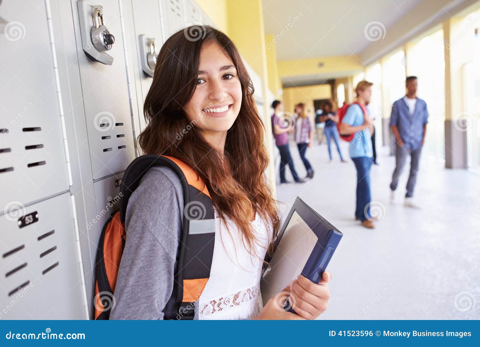 Female High School Student Standing by Lockers Stock Photo - Image of ...