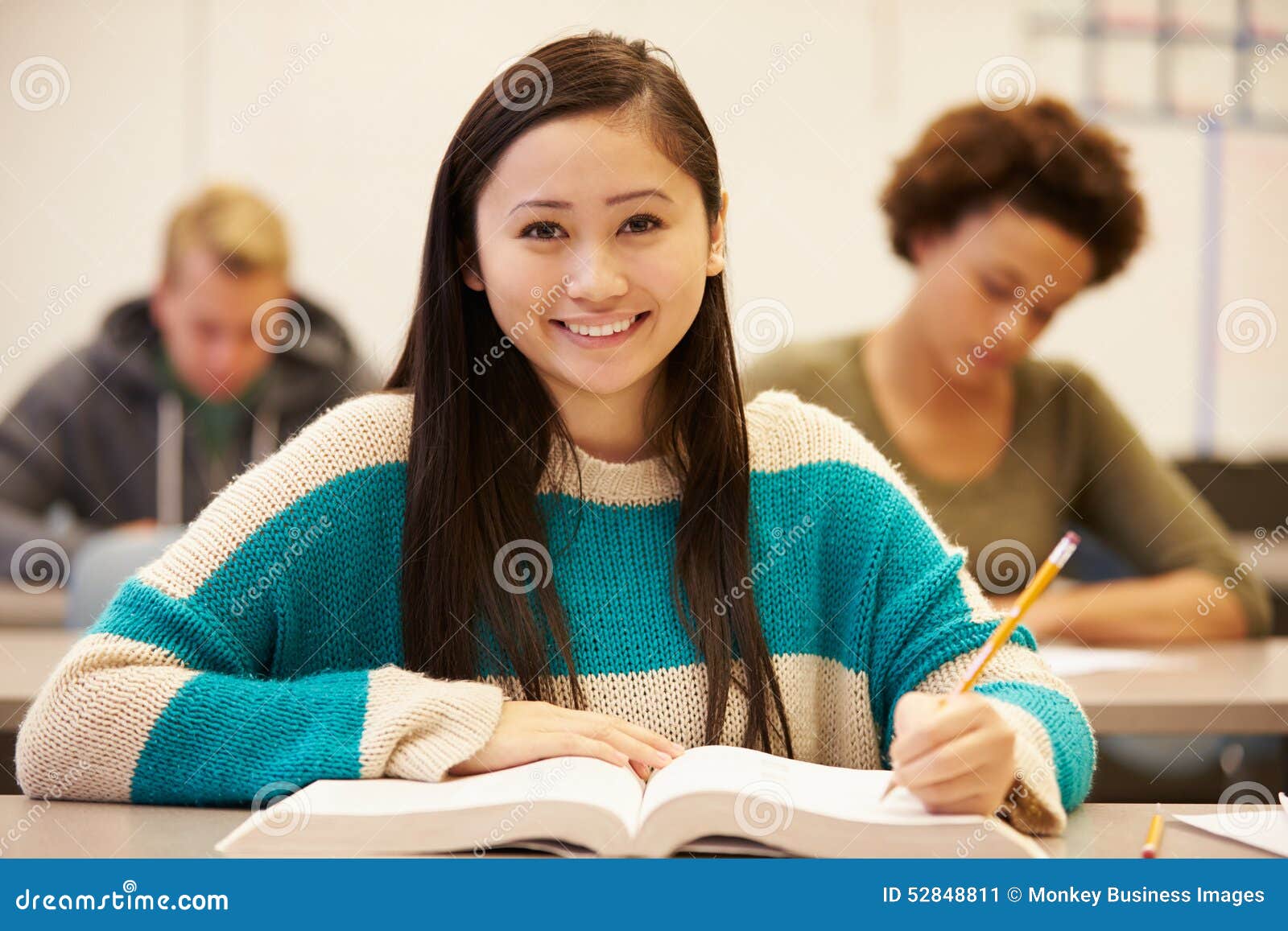 Female High School Student Studying at Desk in Classroom Stock Image ...