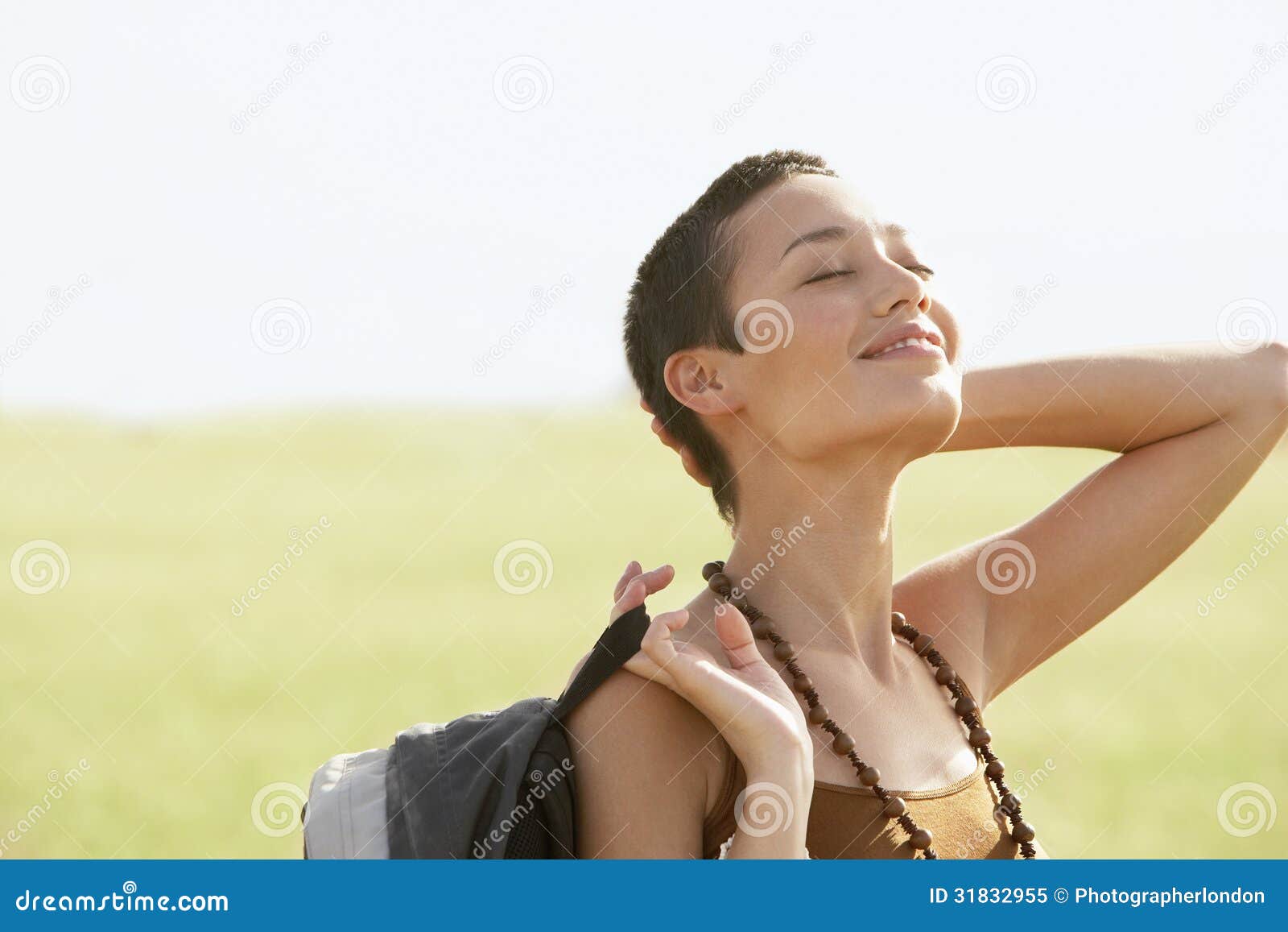 Female Hiker Basking in Sun in Field Stock Image - Image of leisure ...