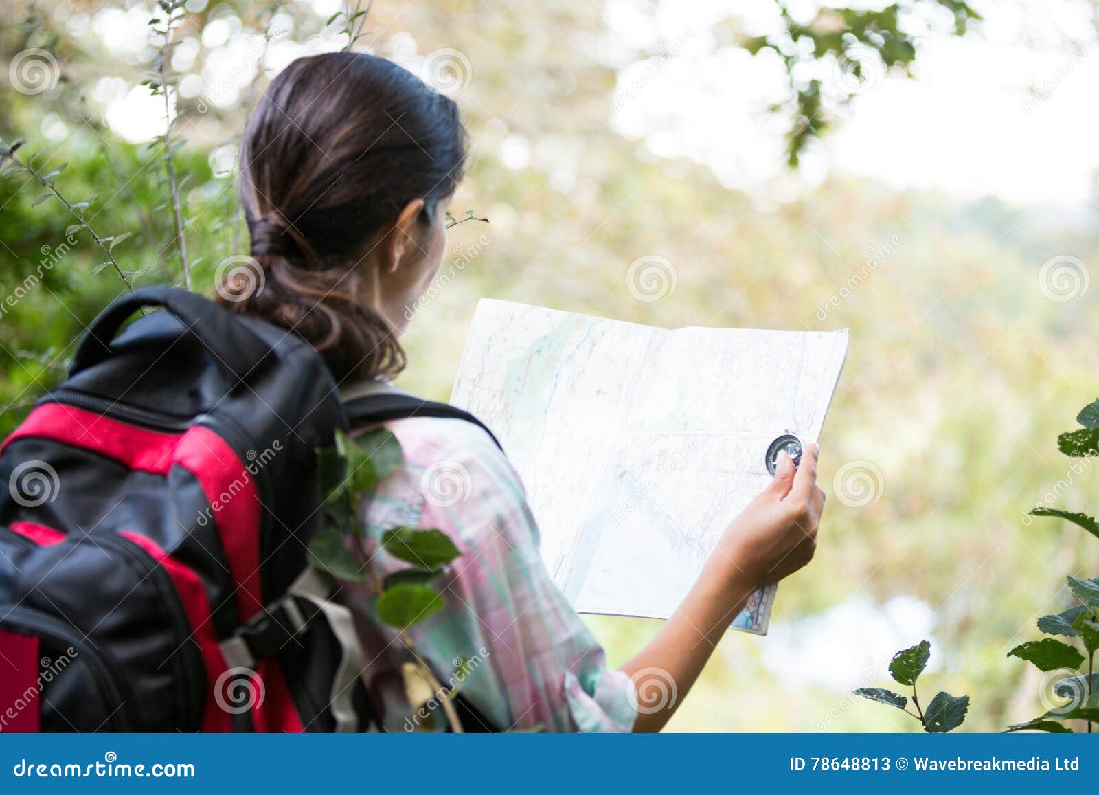 Female Hiker Looking at Map Stock Image - Image of guiding, mixedrace ...