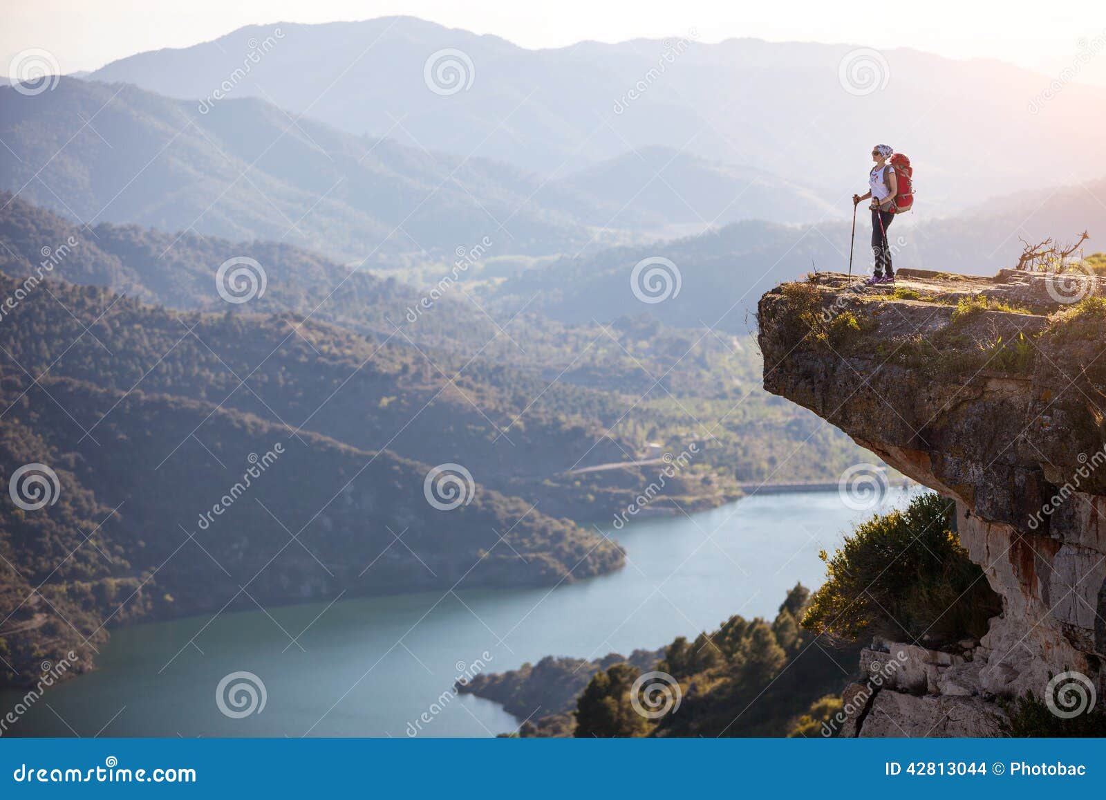 Hiker Standing On Preikestolen And Looking On The Fjerd, Preikestolen ...