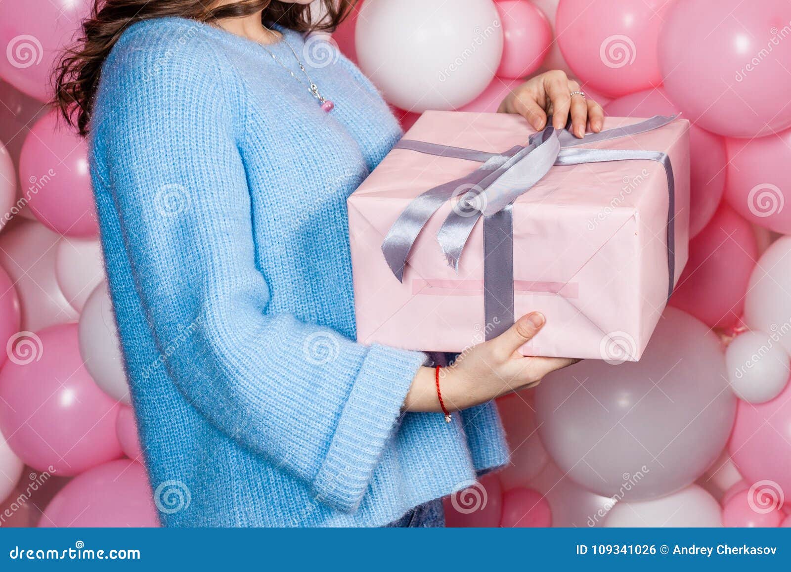 Female hold gift in hands stock photo. Image of closeup - 109341026