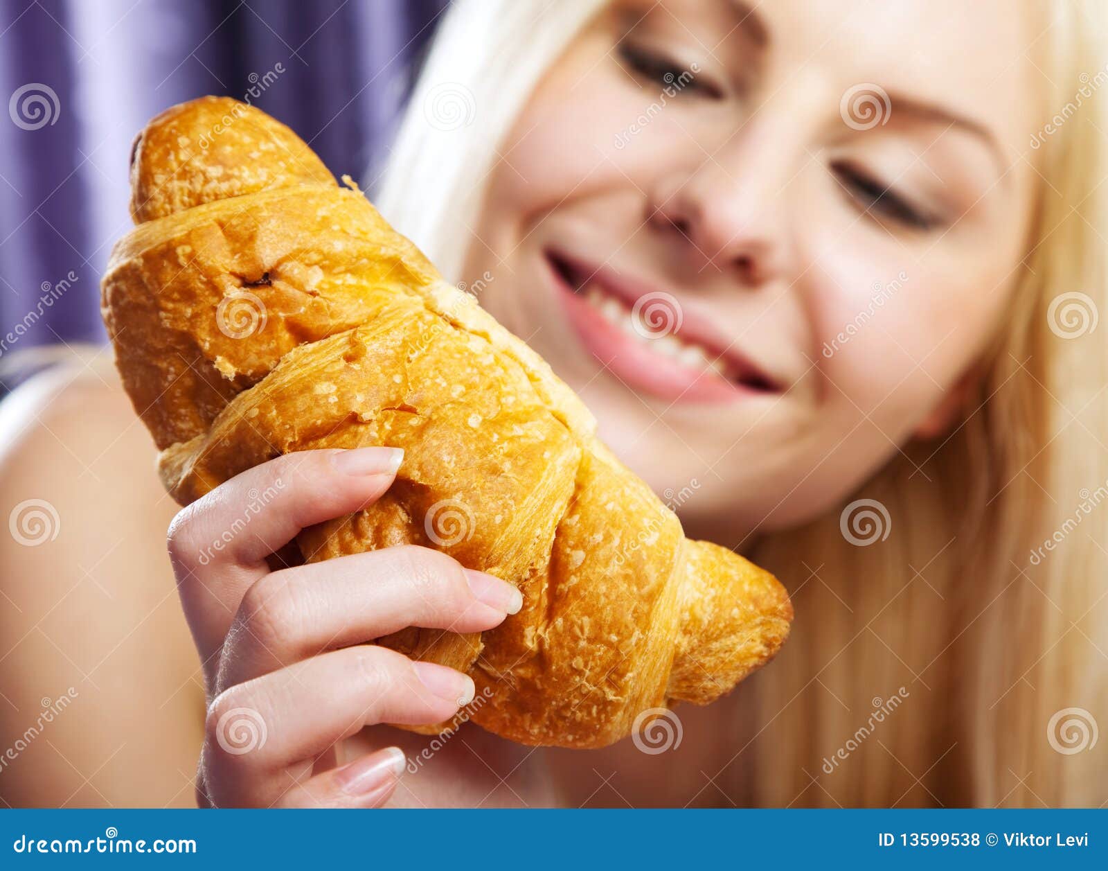 Female holding croissant stock photo. Image of attractive - 13599538