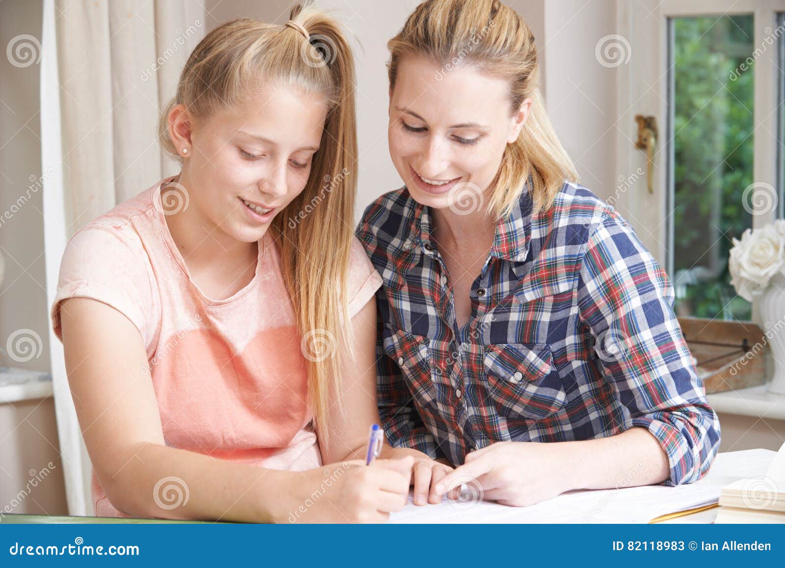Female Home Tutor Helping Girl with Studies Stock Image - Image of ...