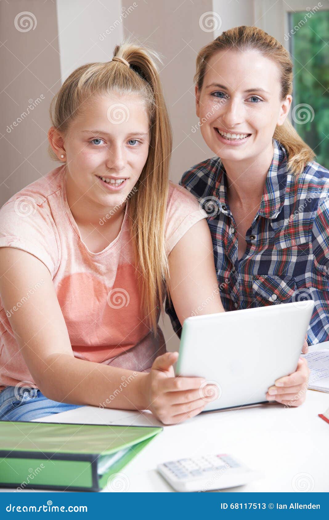 Female Home Tutor Helping Girl with Studies Using Digital Tablet Stock ...