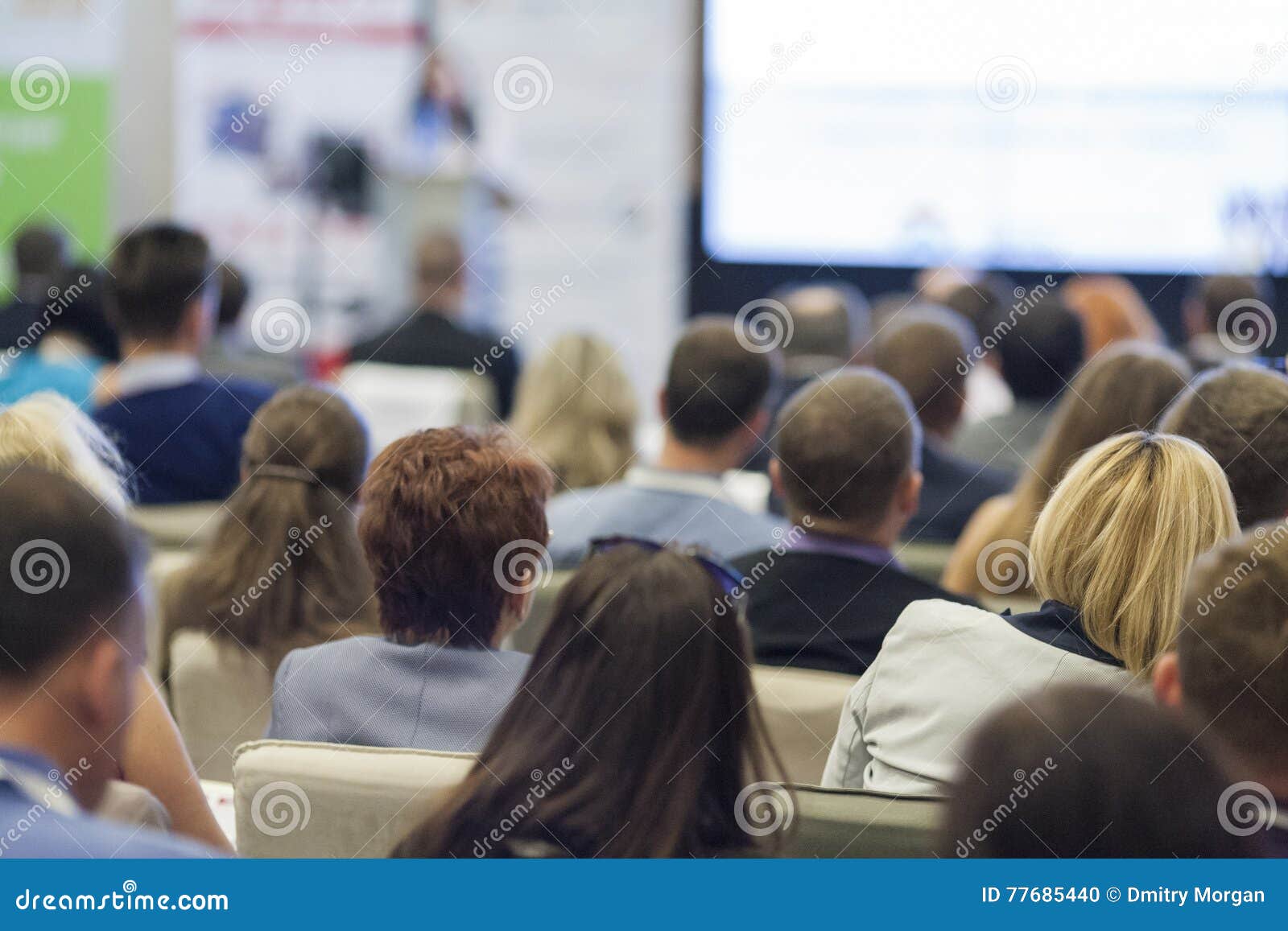 Female Host Speaking in Front of the Large Audience during Business ...