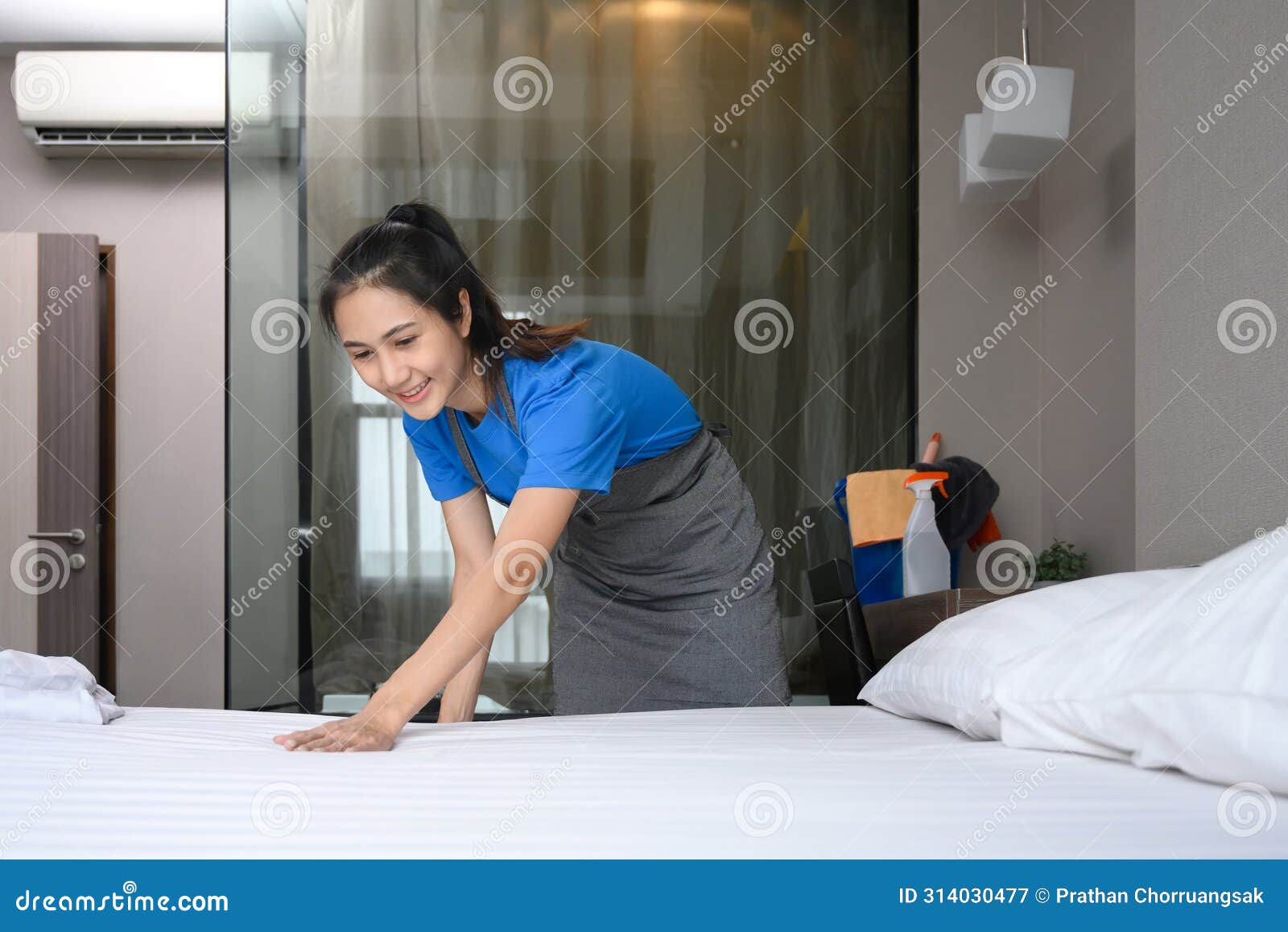 Female Housekeeper Changing Clean Bedsheets in Hotel Room Stock Image ...