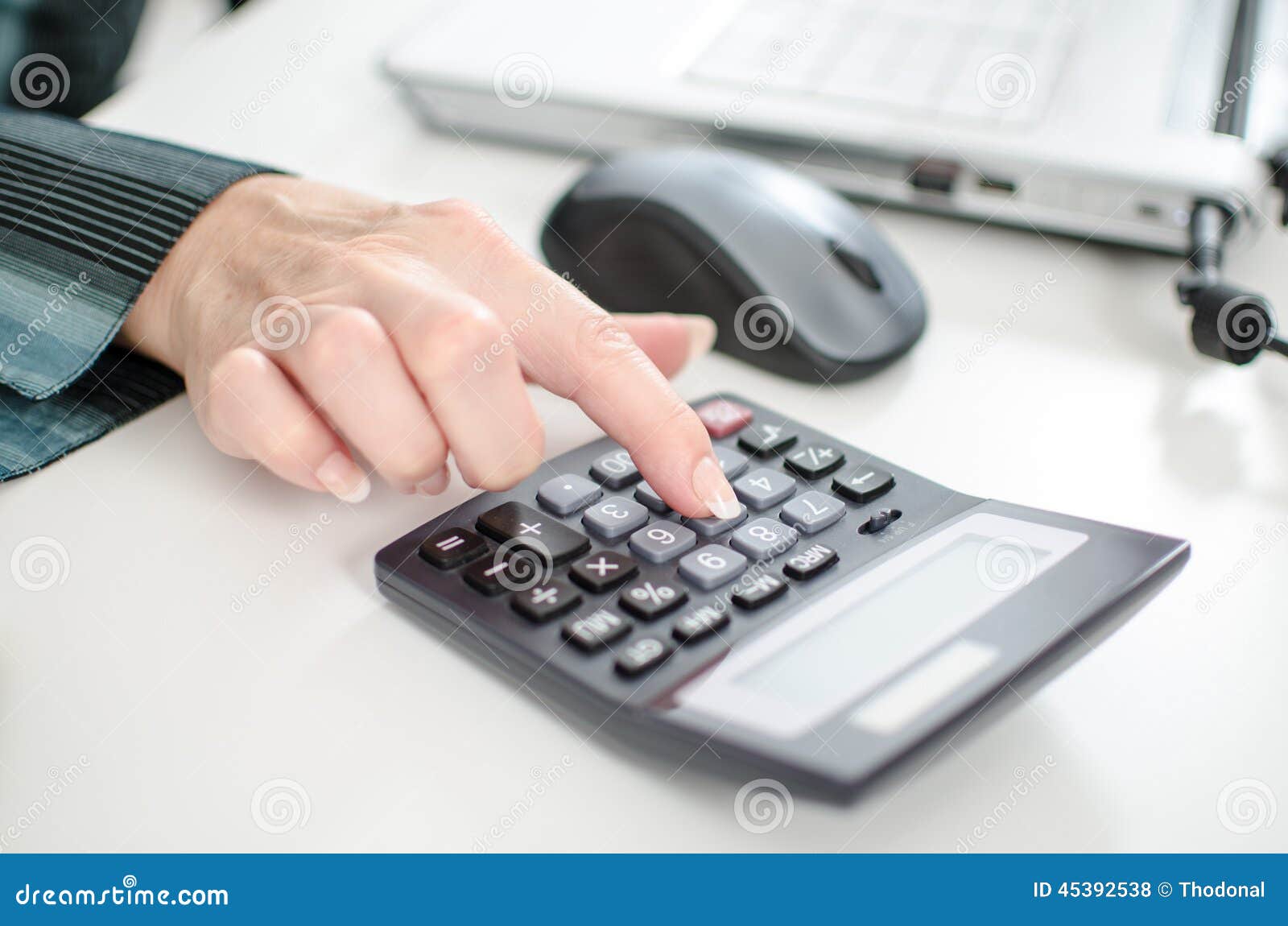 Female Index Finger Typing on a Calculator Stock Photo - Image of table ...