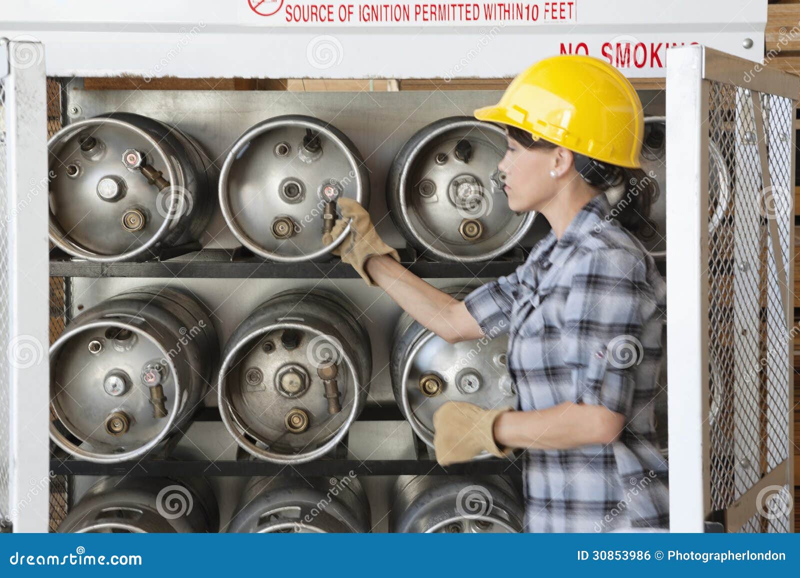 Female Industrial Worker Taking Out Propane Cylinder Stock Photo ...
