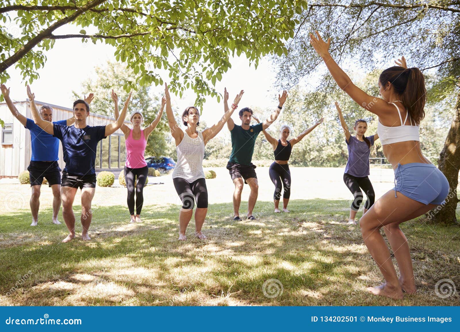 Female Instructor In Yoga Dancing Shiva Pose Variation Royalty-Free ...