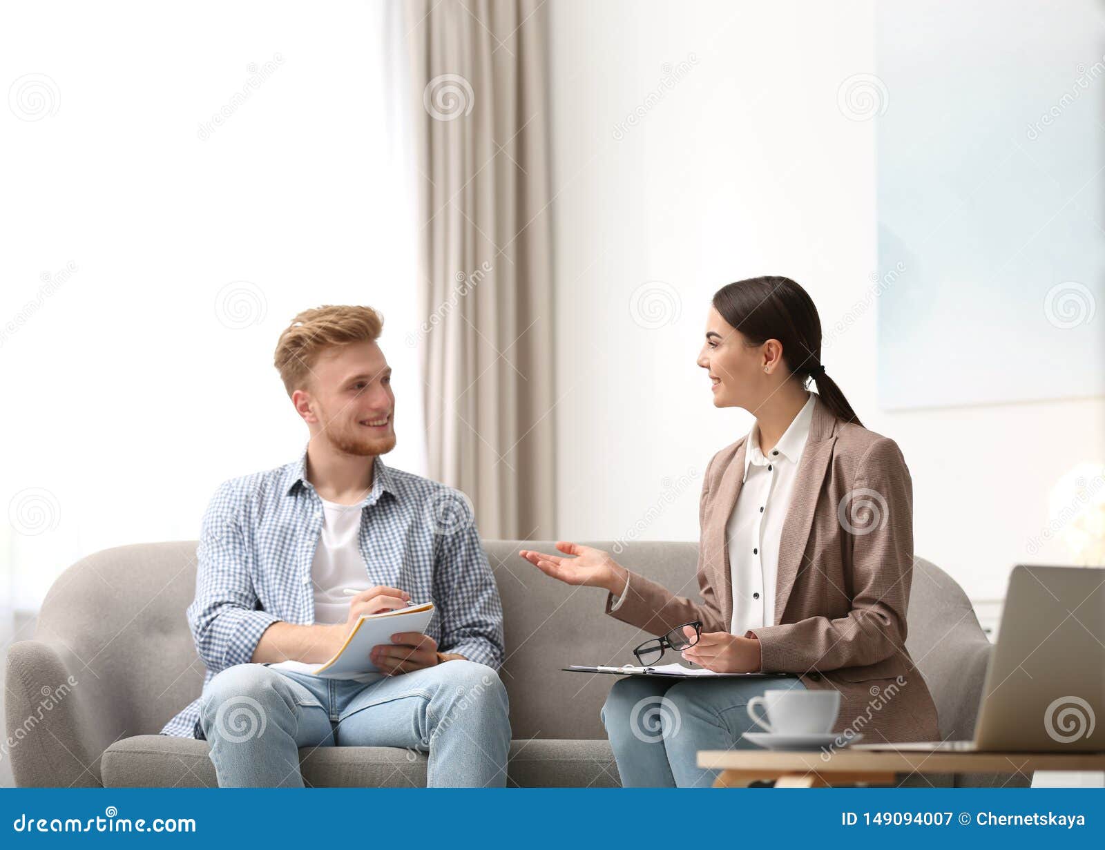 Female Insurance Agent Consulting Young Man Stock Image - Image of ...