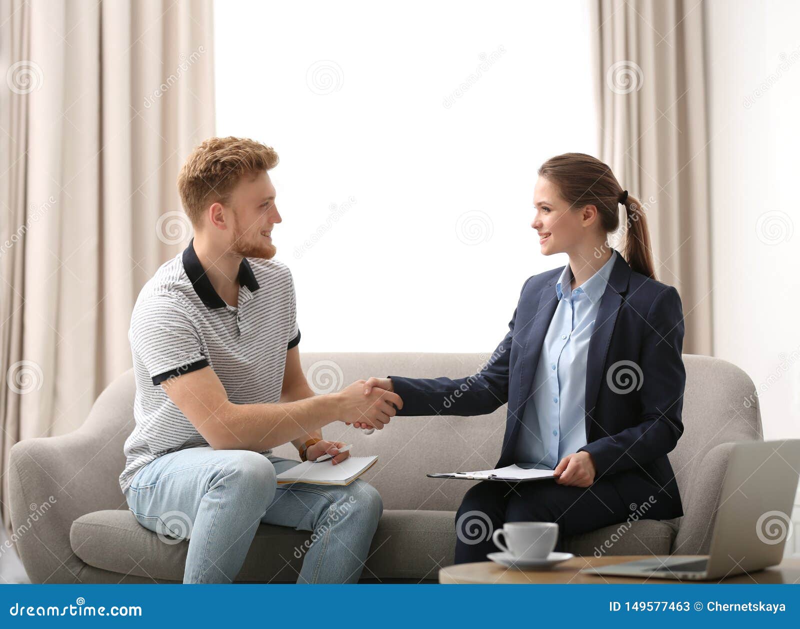Female Insurance Agent Shaking Hands with Young Man Stock Image - Image ...