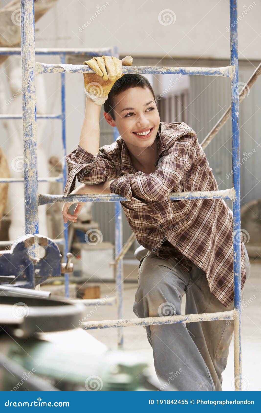 Female Interior Decorator Leaning on Scaffolding Stock Image - Image of ...