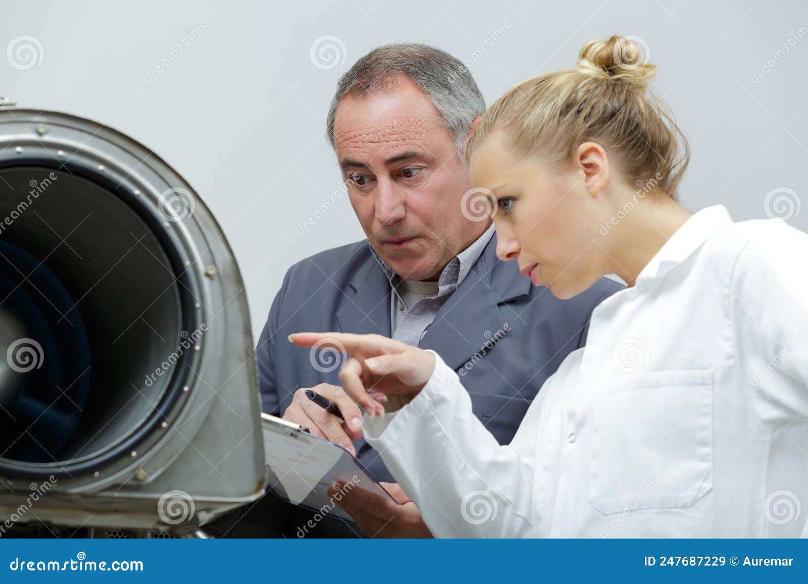 Female Jet Engineer Pointing at Material Stock Image - Image of ...