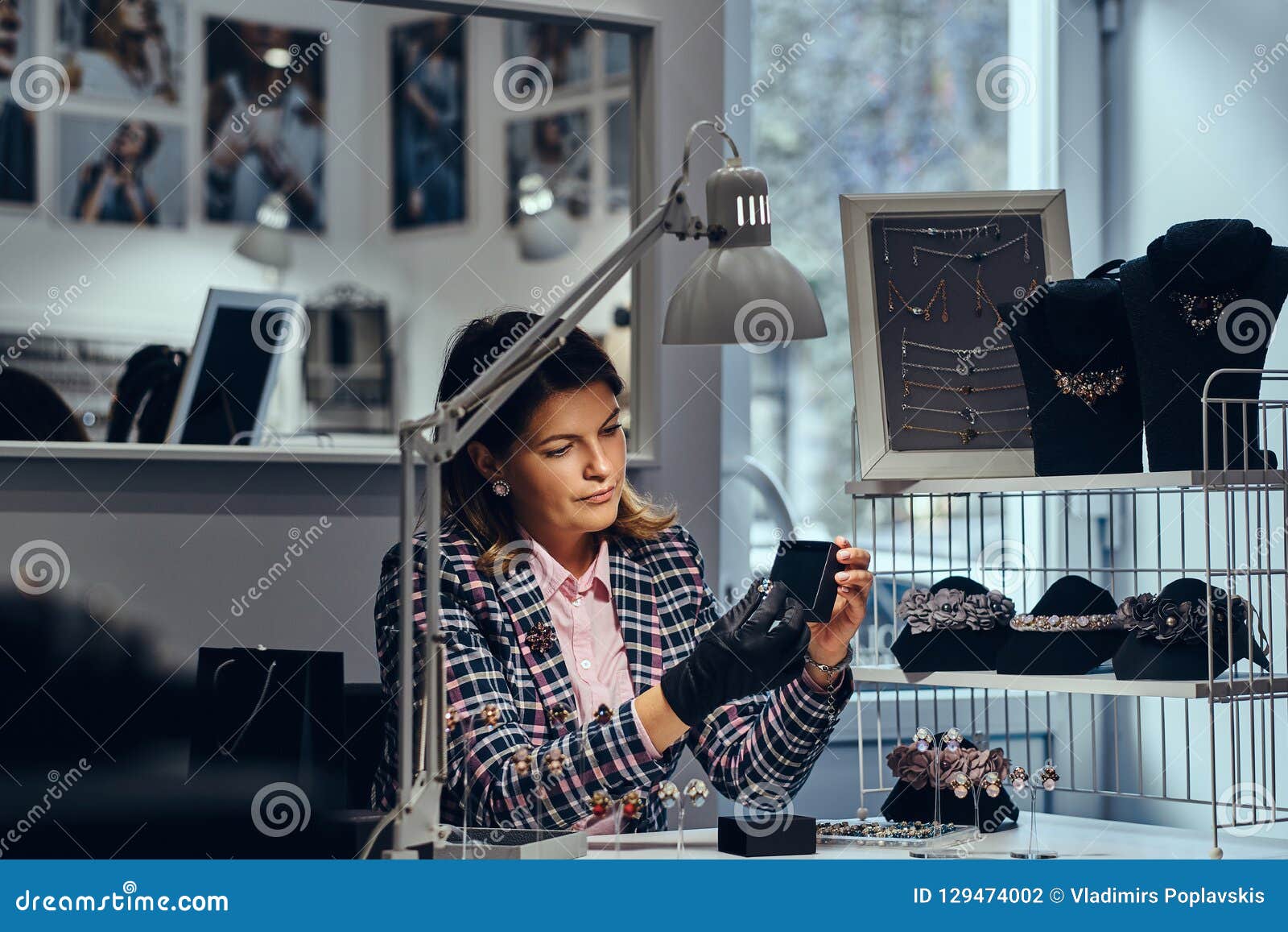Female Jewelry Worker Elegantly Dressed Sitting at Work Table and Make ...