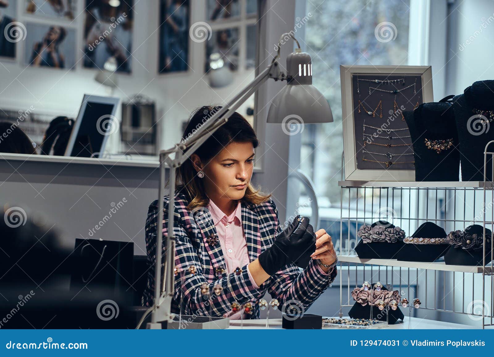 Female Jewelry Worker Elegantly Dressed Sitting at Work Table and Make ...