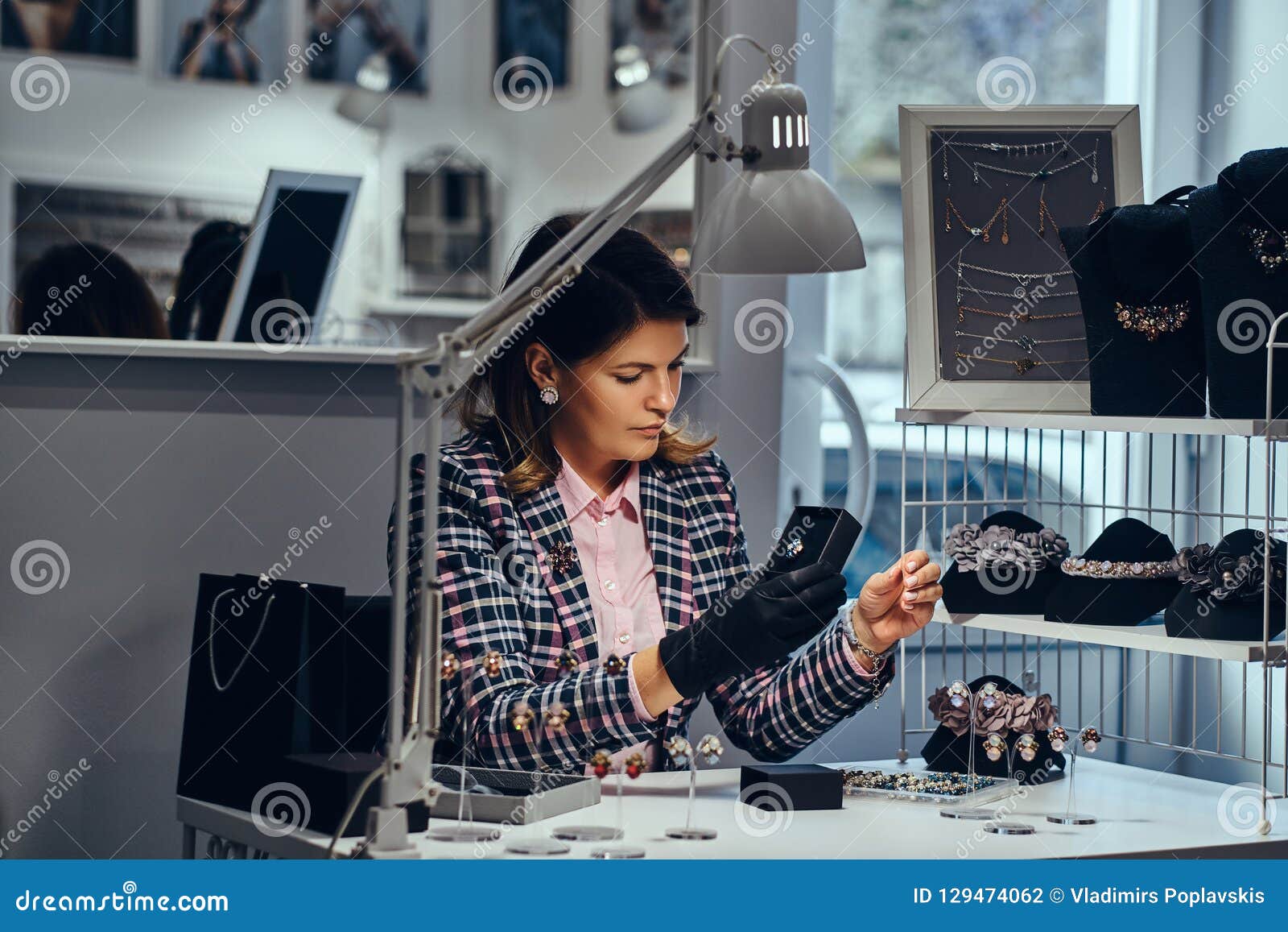 Female Jewelry Worker Elegantly Dressed Sitting at Work Table and Make ...