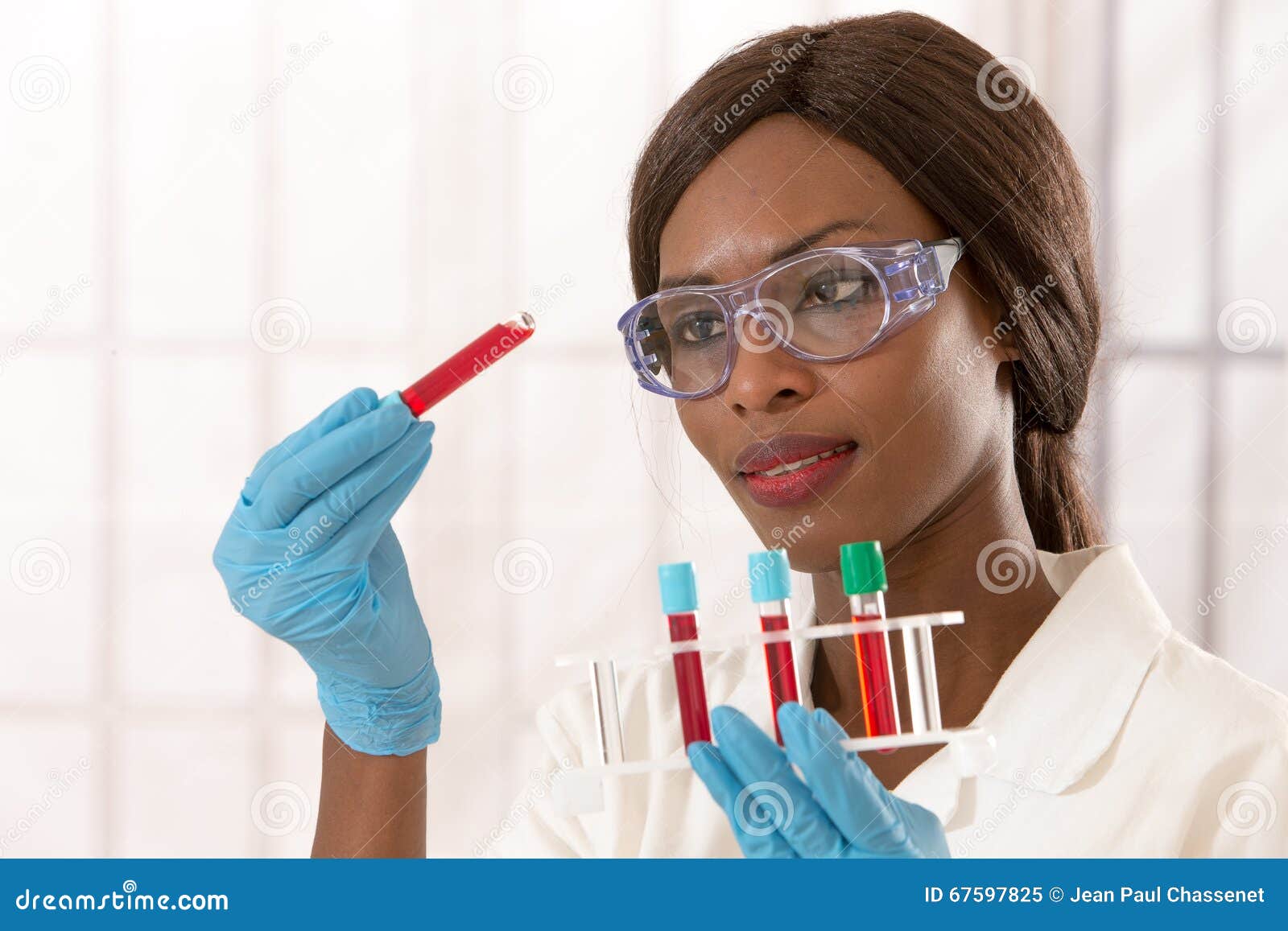 Female Lab Assistant Studying Blood Sample for Analysis Stock Image ...