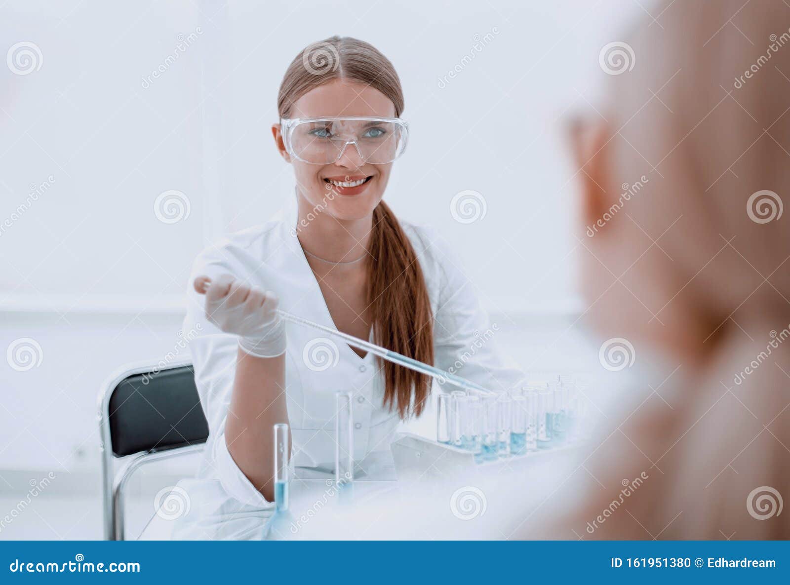 Female Lab Technician Testing Liquid in Vials. Stock Photo - Image of ...