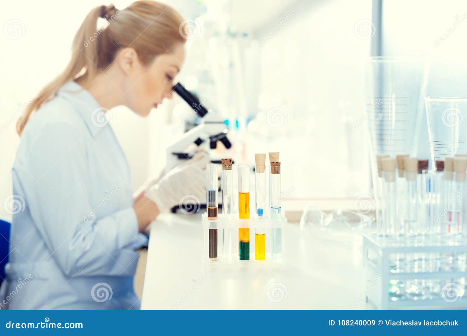 Female Lab Worker Analyzing Sample Under Microscope Stock Image - Image ...