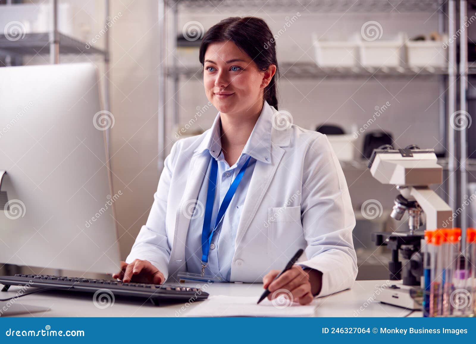 Female Lab Worker Wearing PPE Face Shield Recording Blood Test Results ...