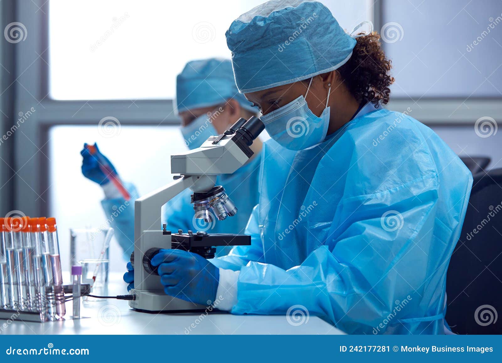 Female Lab Workers Wearing PPE Researching in Laboratory with ...