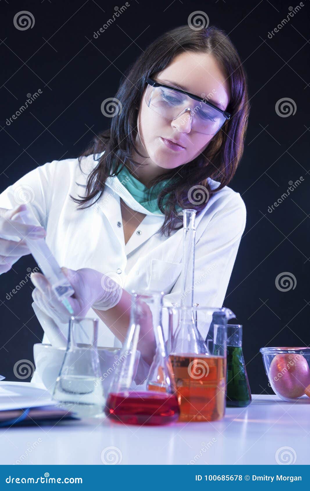 Female Laboratory Assistant Making an Injection with Syringe during a ...