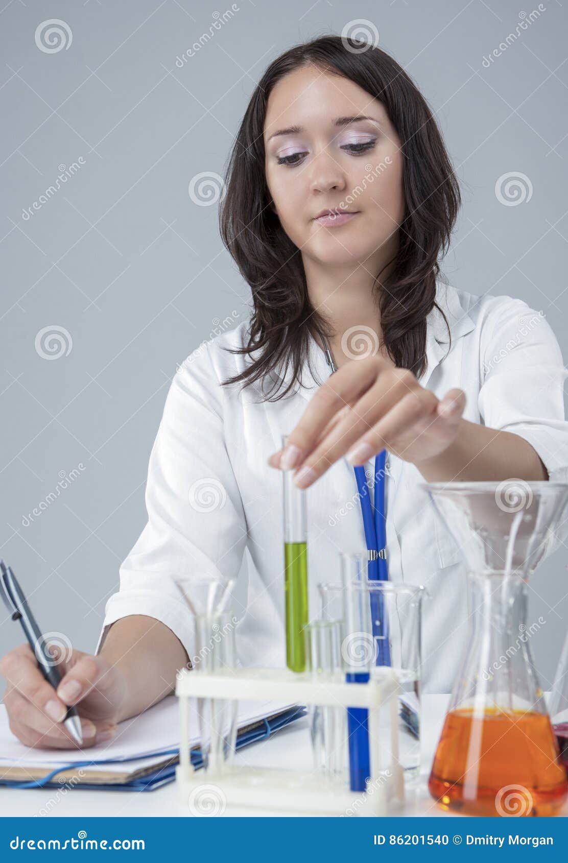 Female Laboratory Staff Working with Flasks Filled with Liquids Stock ...