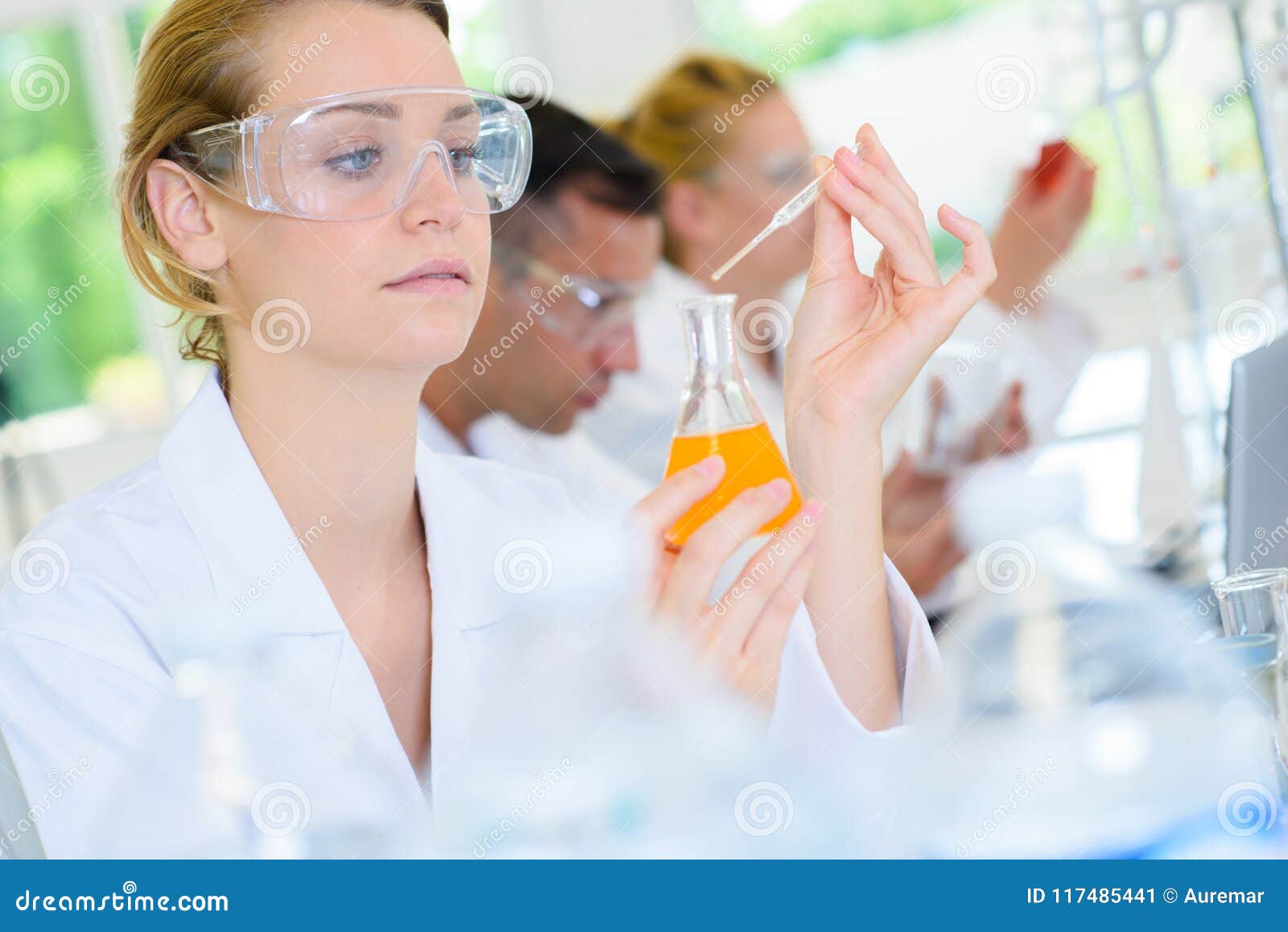 Female Laboratory Technician Using Pipette Stock Image - Image of flask ...
